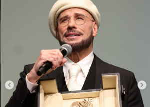 John Travolta Comes to Cannes in a Beret, Gets A Surprise Award, and ...